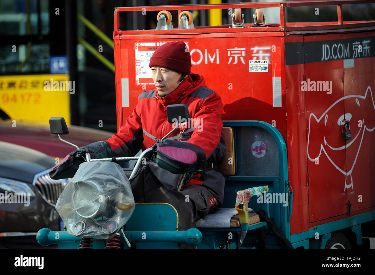 An electric tricycle for Jingdong shuttle in the street in Beijing ...