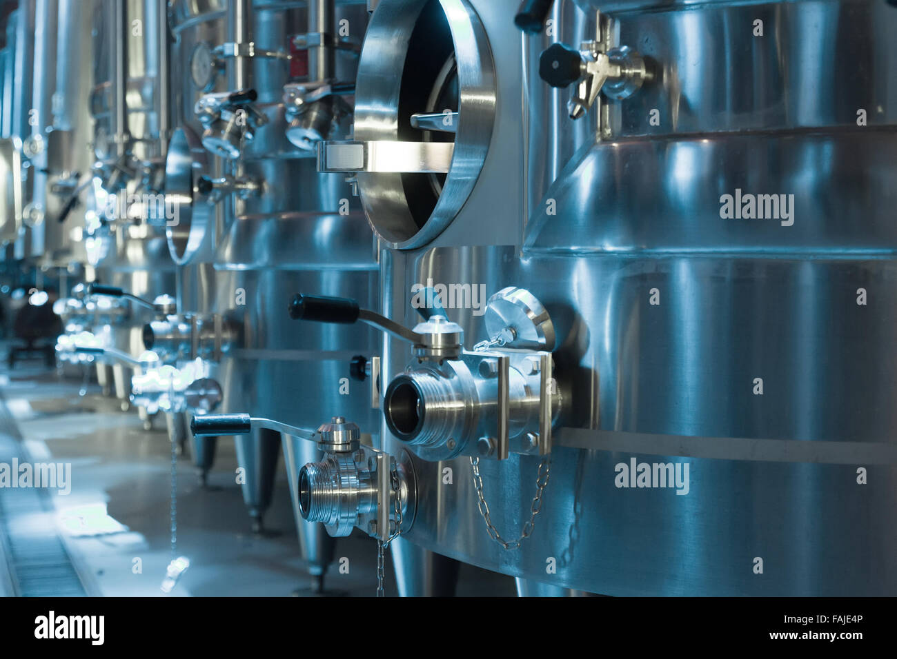 Closeup of equipment of contemporary winery with stell barrels Stock ...