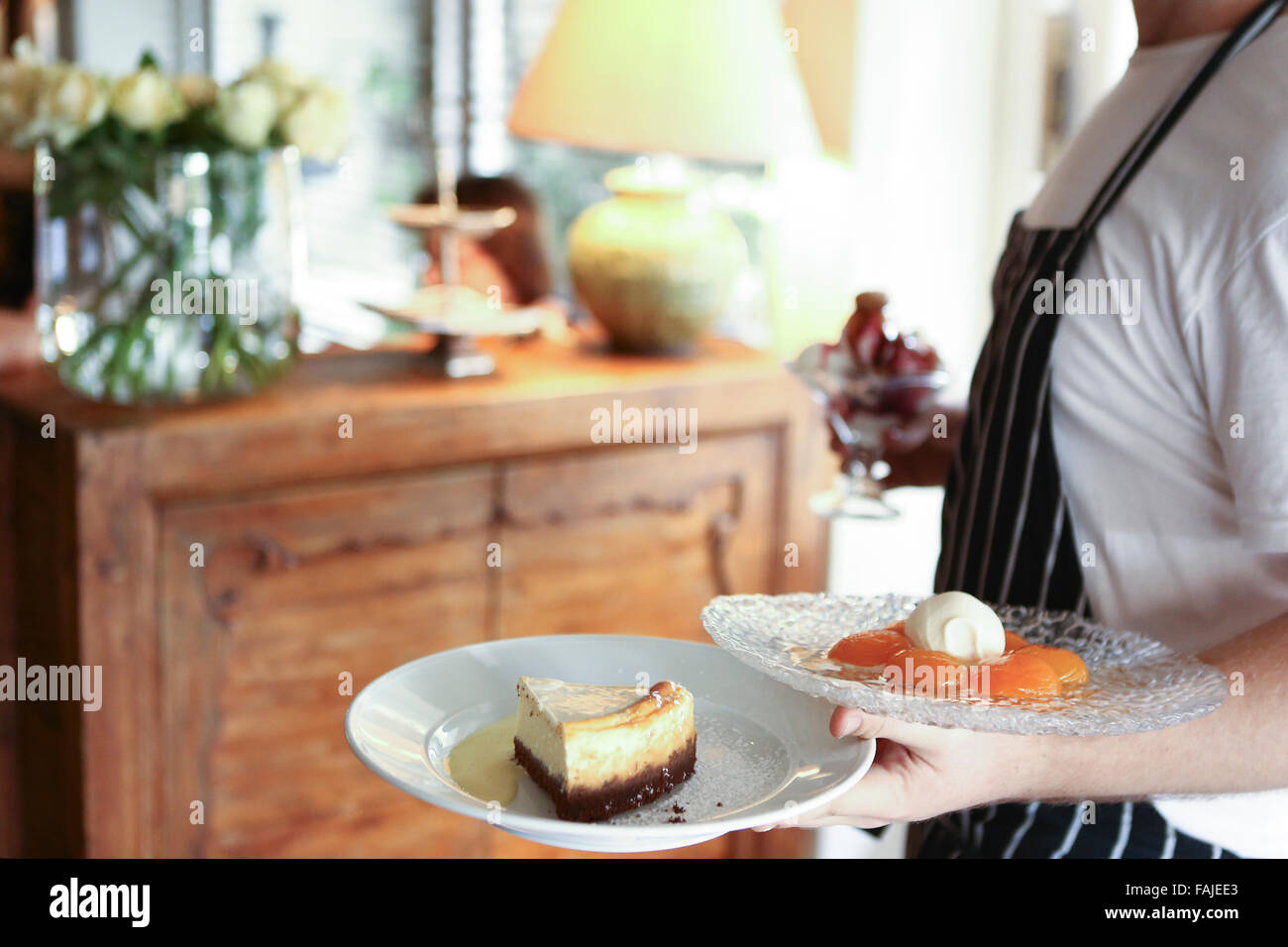 Restaurant waiter carrying plates food hi-res stock photography and ...