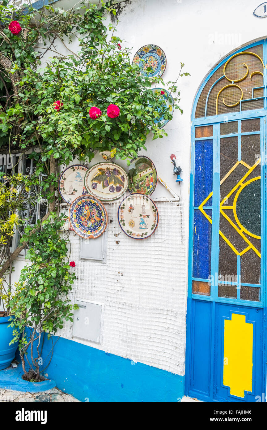 traditional algarve pottery on display at the facade of a house in alte ...