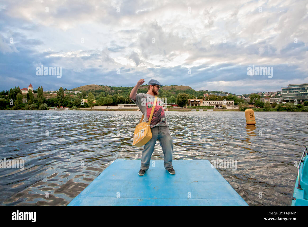 Man balancing on the top of the boat Stock Photo - Alamy
