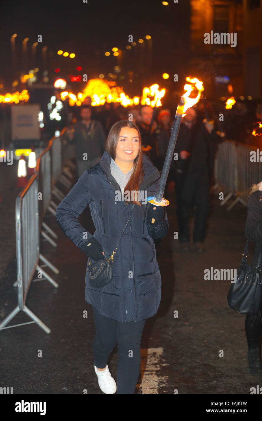 Edinburgh, Scotland. 30th December 2015. A pretty girl marches holding ...