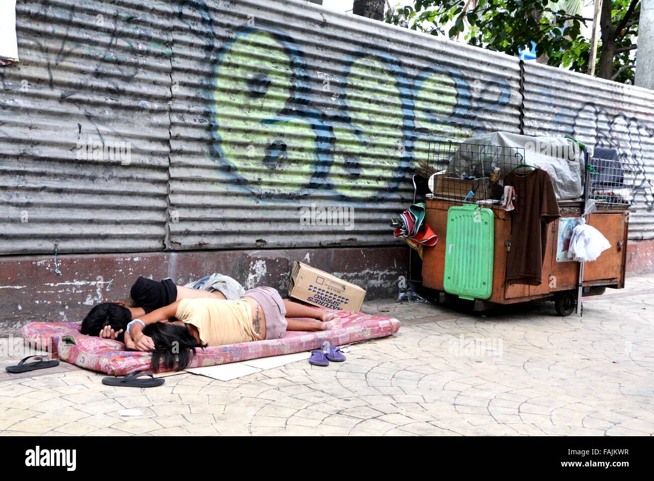 Manila, Philippines. 30th Dec, 2015. A Filipino family living in the ...