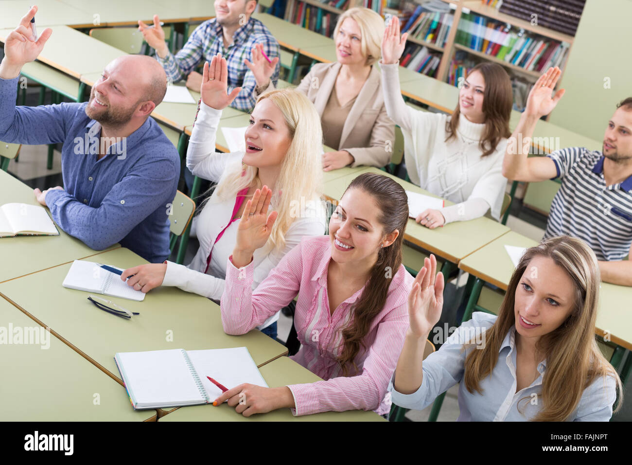 positive students of different age taking active part in discussion ...