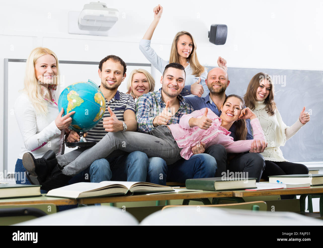 Positive professor and group of students at extension courses Stock ...