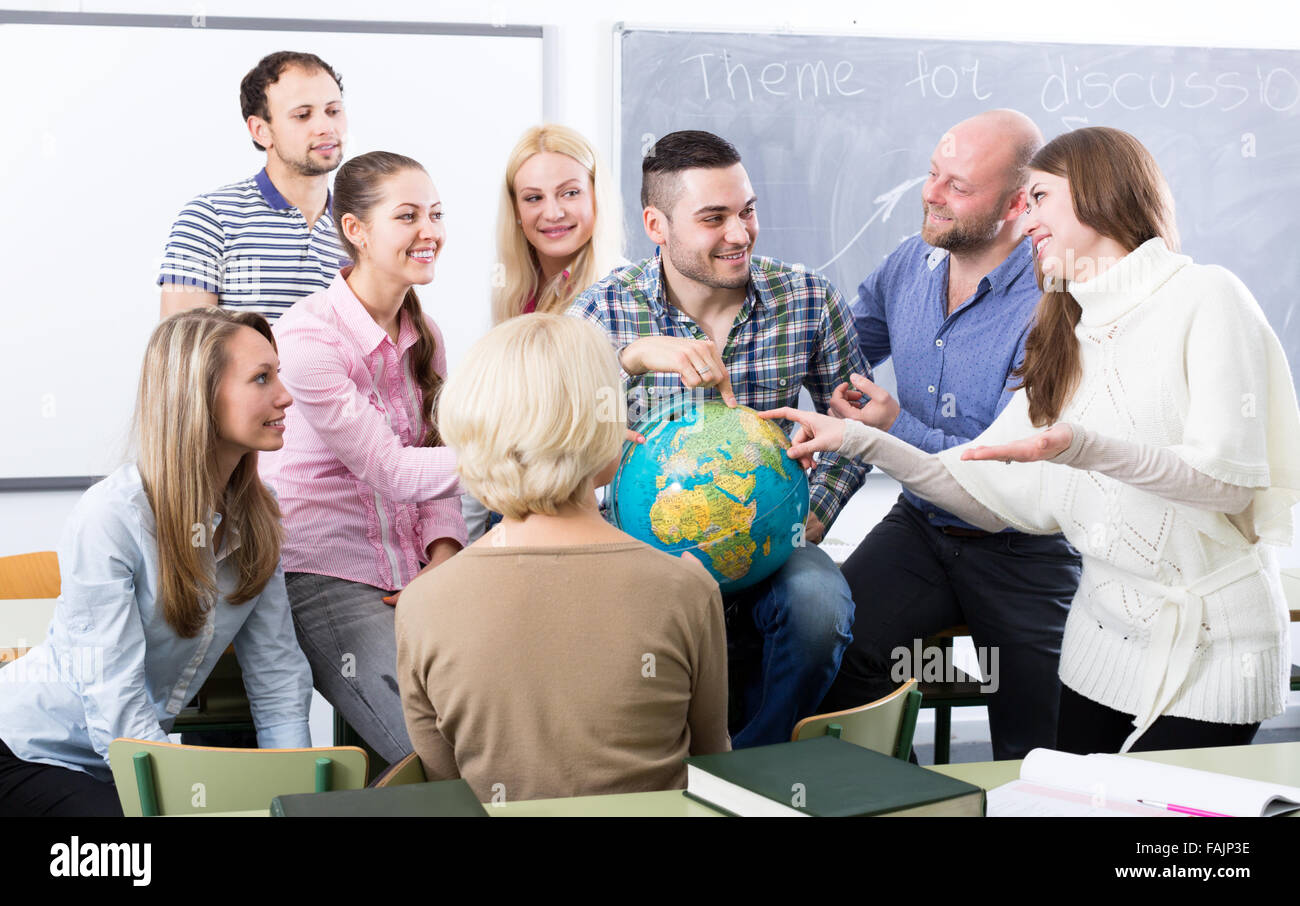 Smiling teacher and adult students during break in classroom Stock ...