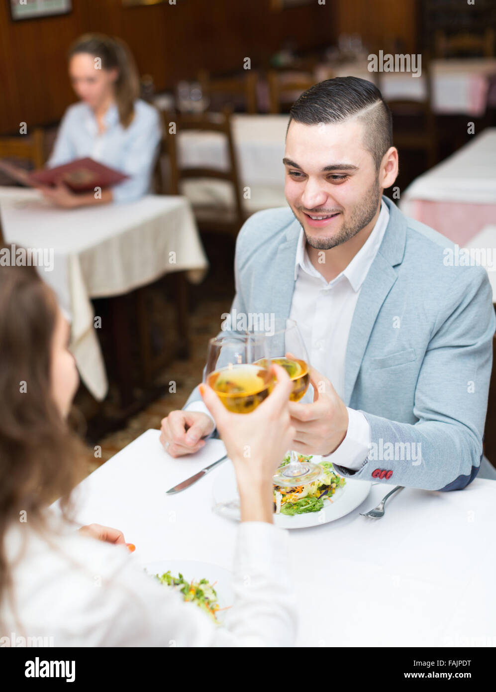 Happy man having romantic dinner with girl in restaurant Stock Photo ...
