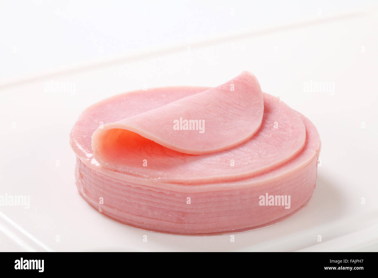 Thin slices of lean ham Stock Photo - Alamy