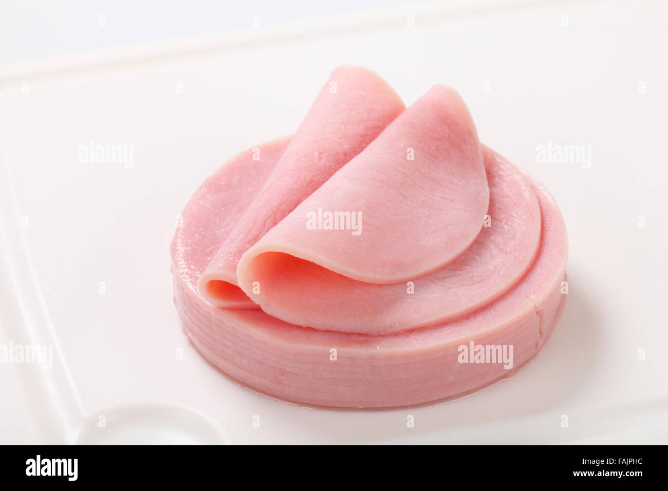 Thin slices of lean ham Stock Photo - Alamy