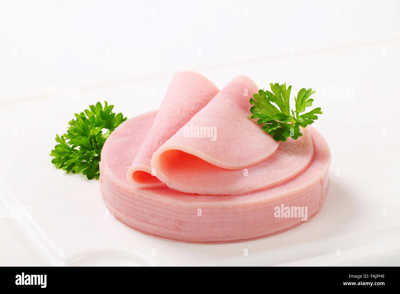 Thin slices of lean ham Stock Photo - Alamy