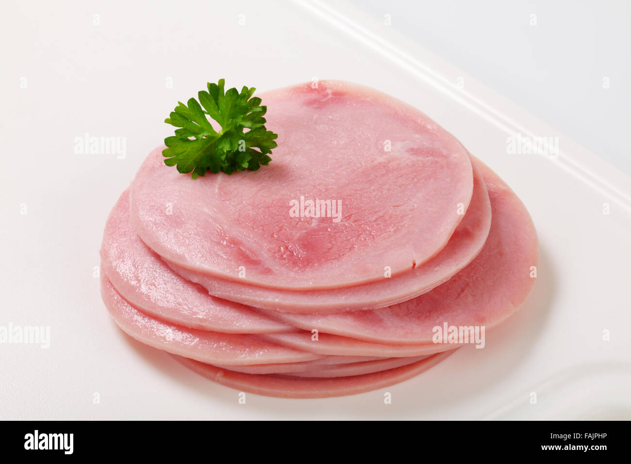 Thin slices of lean ham Stock Photo - Alamy
