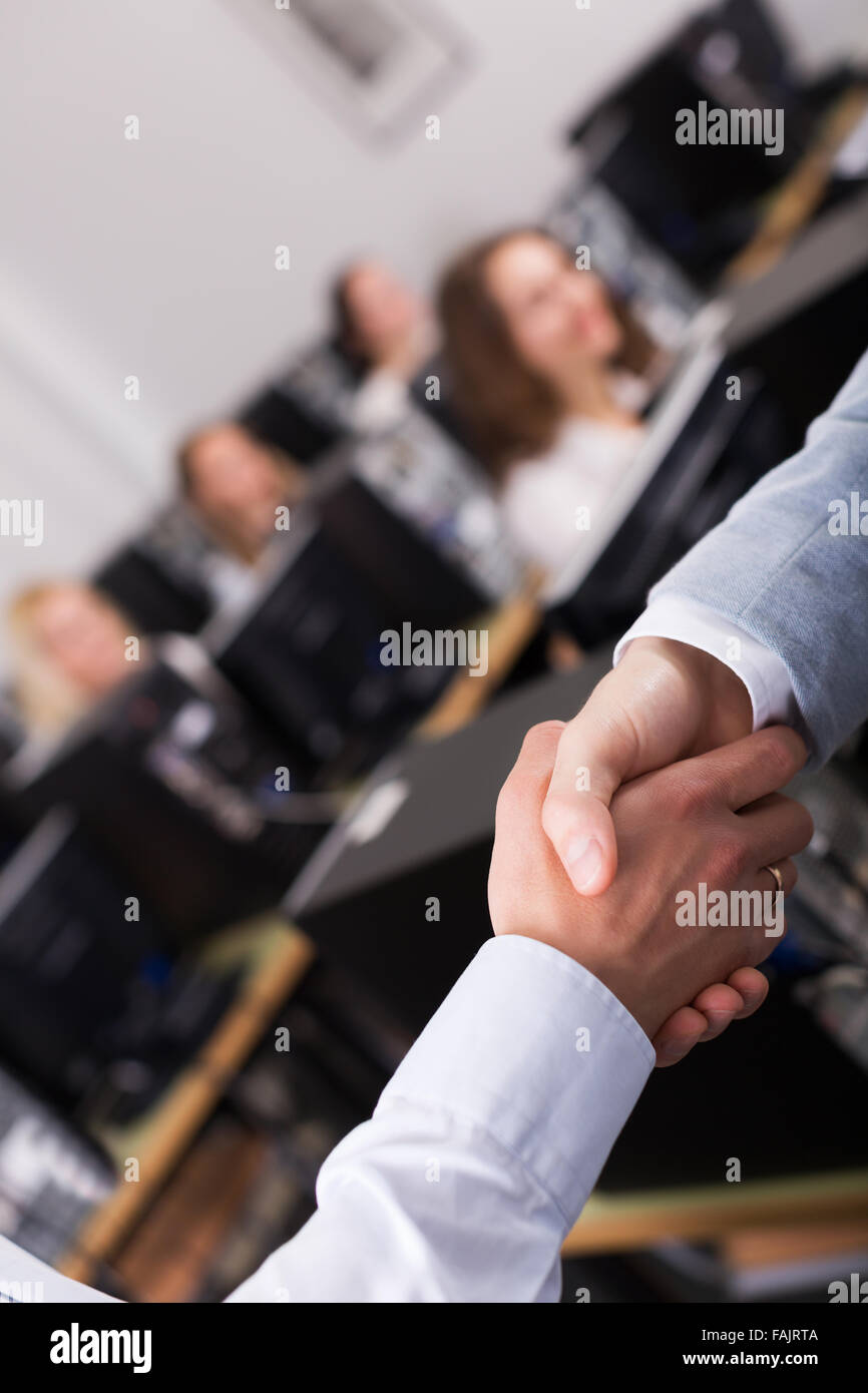 Positive supervisor thanking staff member for good work Stock Photo - Alamy