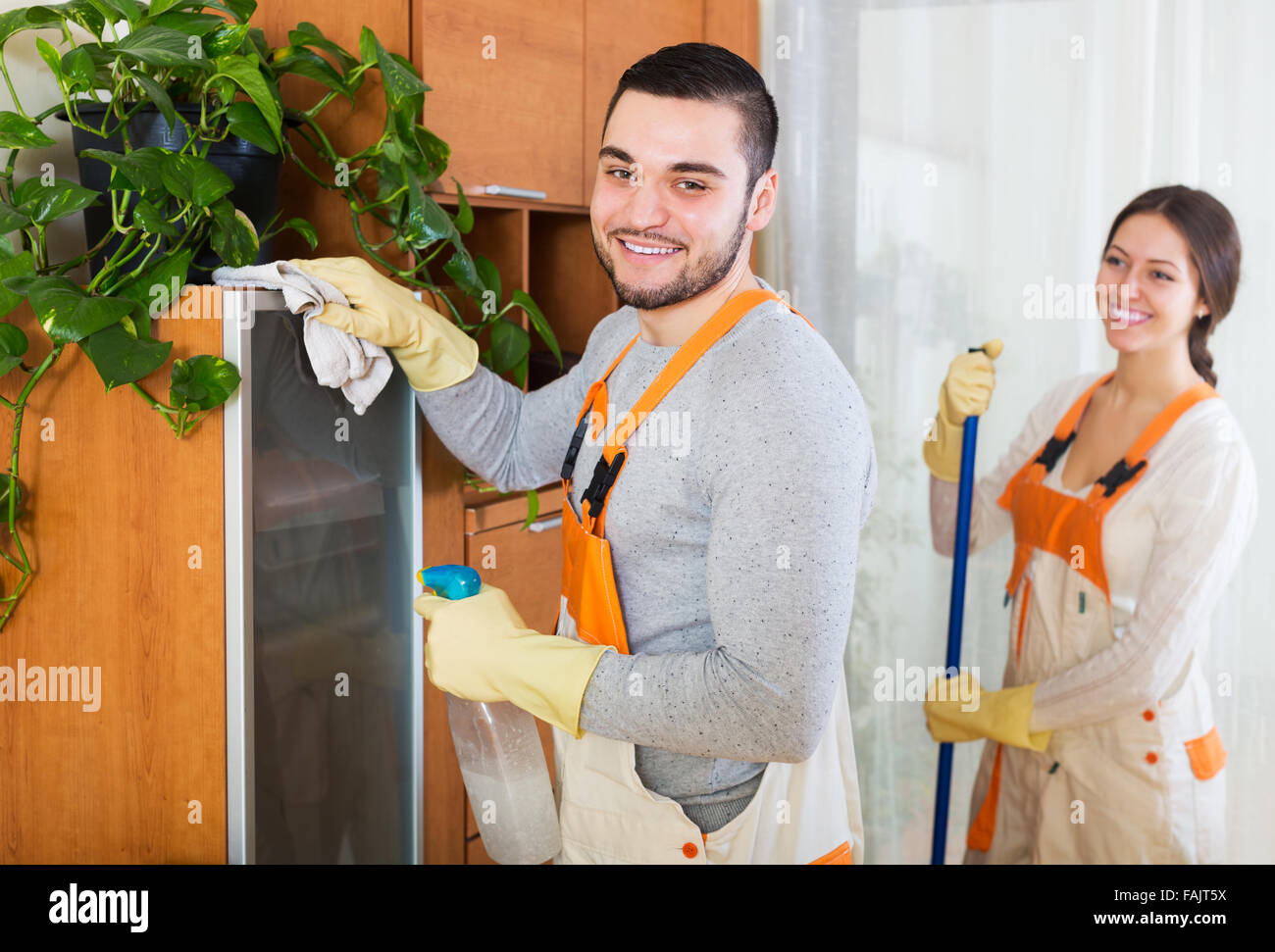 Cleaning premises happy team in uniform is ready to work Stock Photo ...