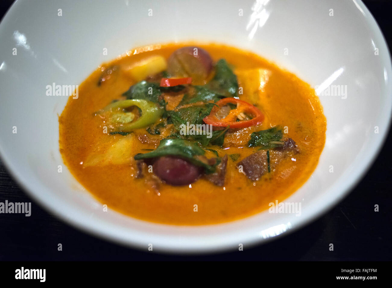 Thai food. Gaeng Phed Ped Yang Kub ar-ngoon. Red curry of roasted duck ...