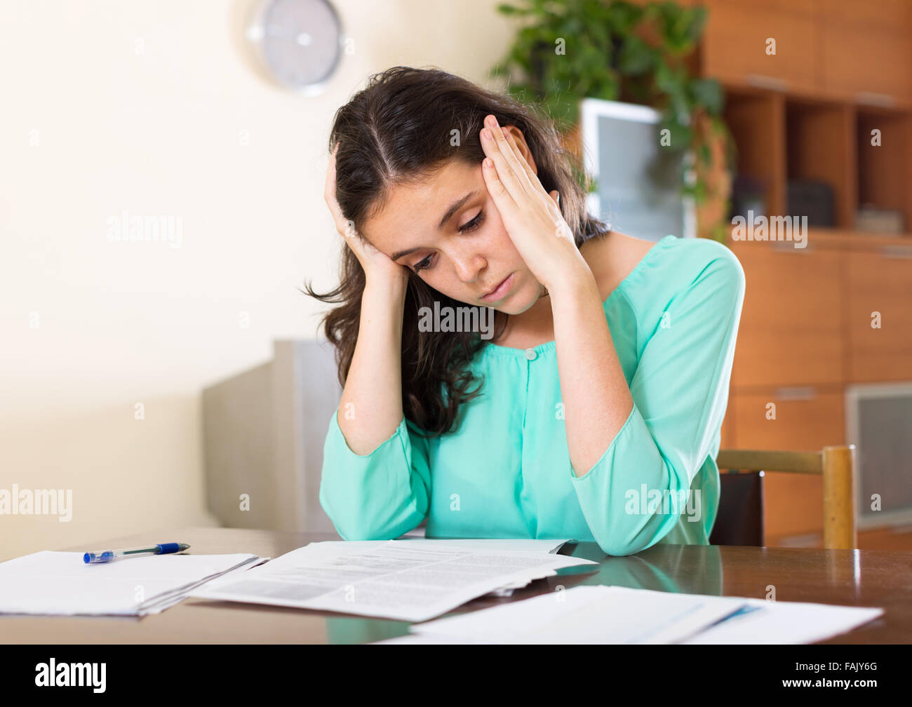 Girl and reading documents and pensive hi-res stock photography and ...