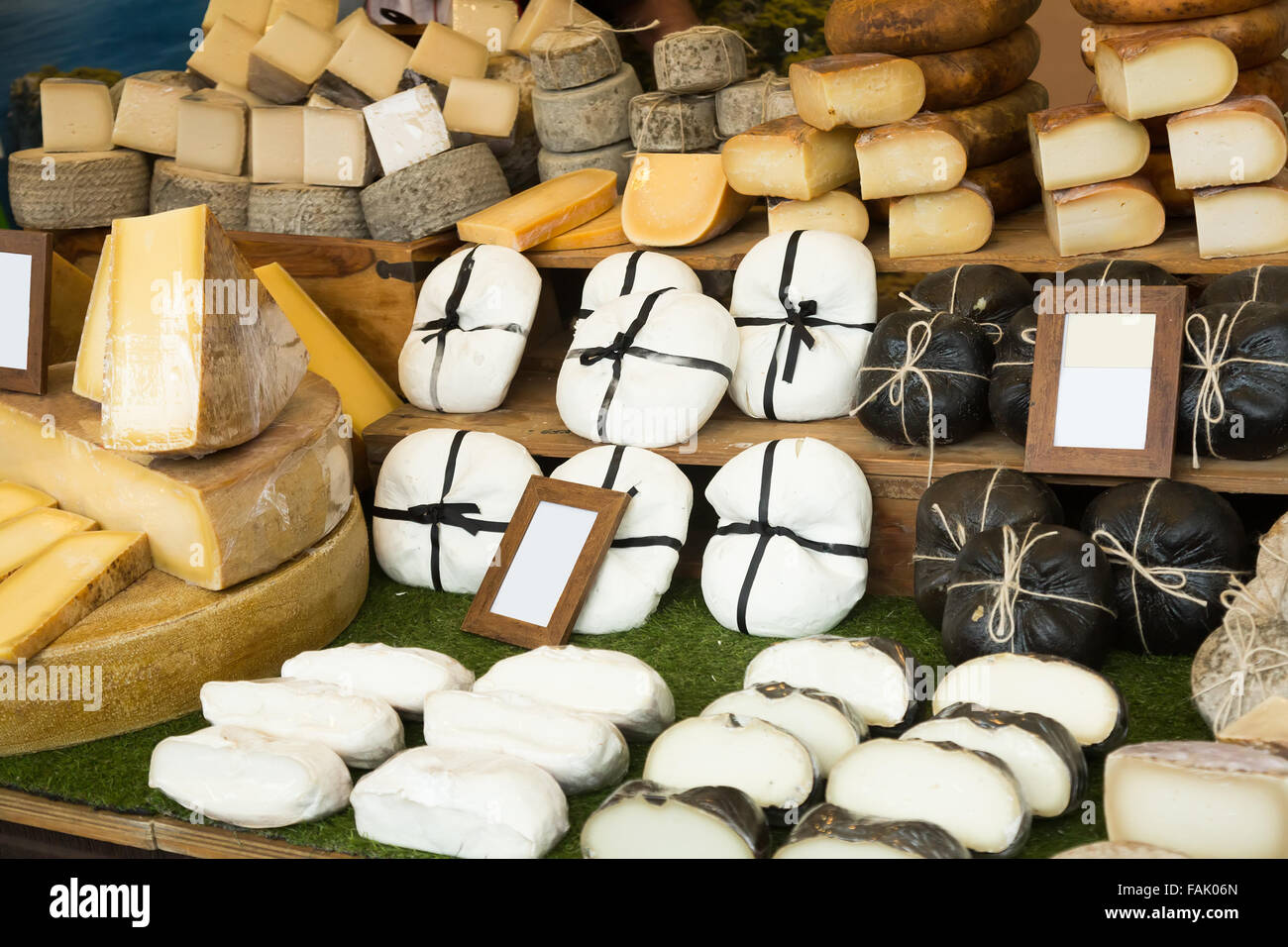 different cheese at shop stand Stock Photo - Alamy