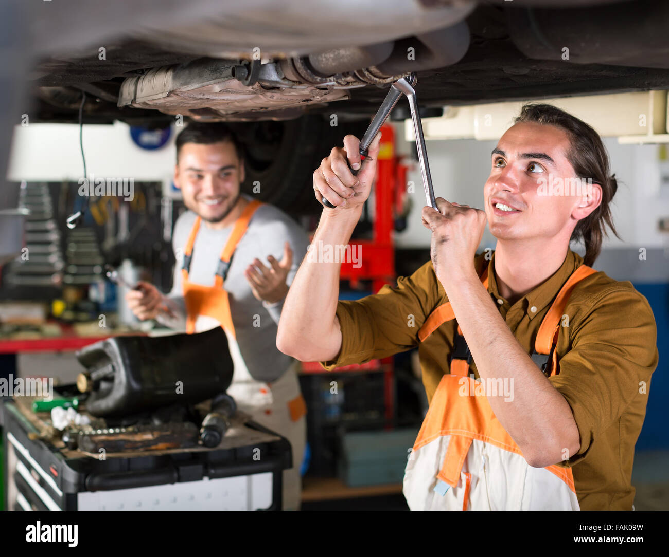 Portrait of two positive mechanics repairing catalyst system in a ...