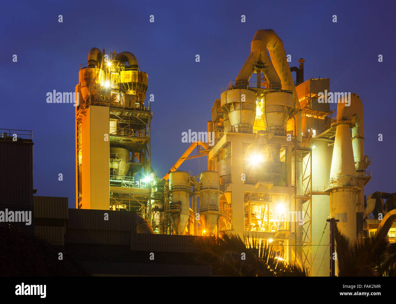 view of cement factory in evening Stock Photo - Alamy