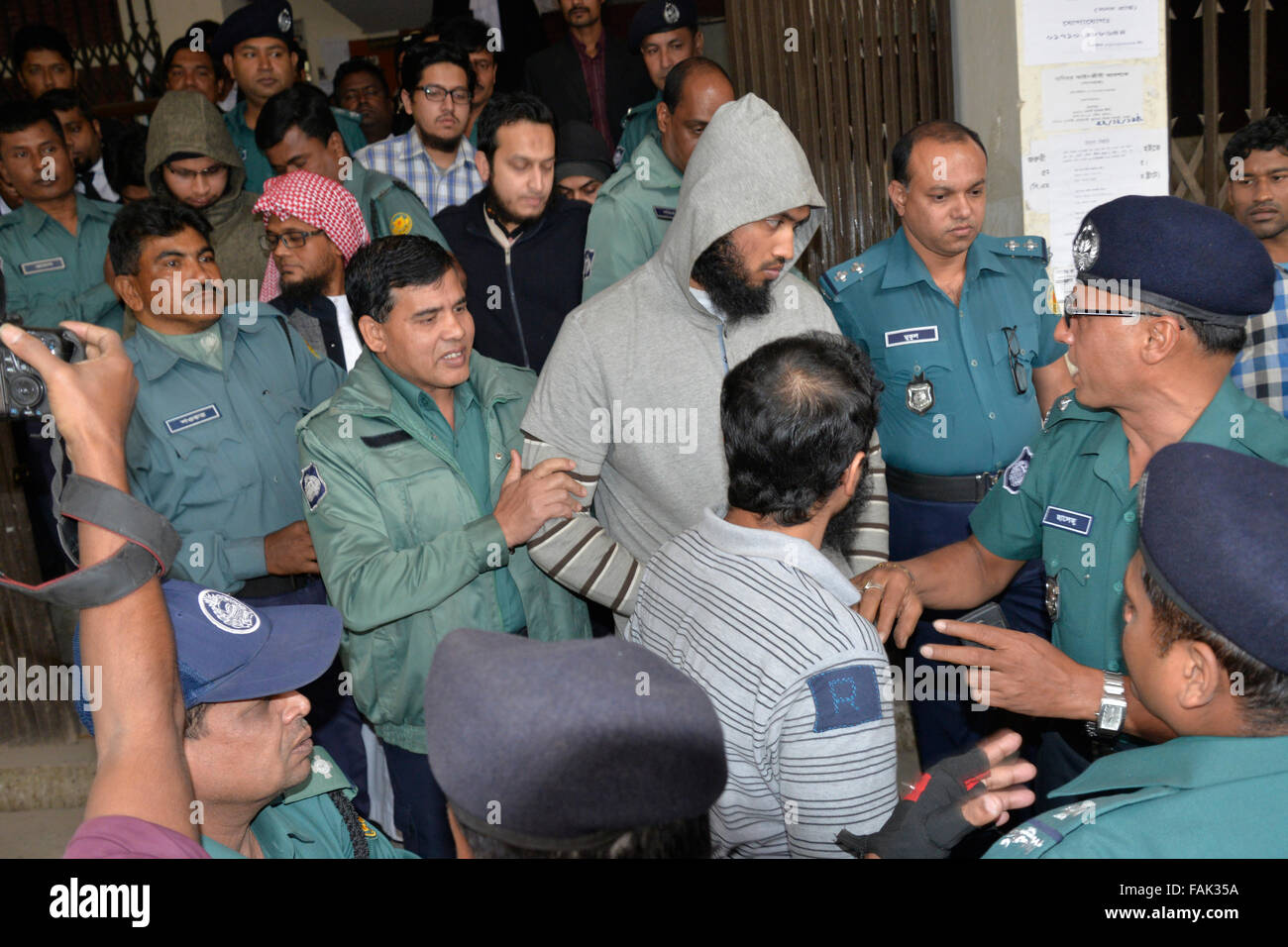Dhaka, Bangladesh. 31st Dec, 2015. Bangladesh police officials escort ...