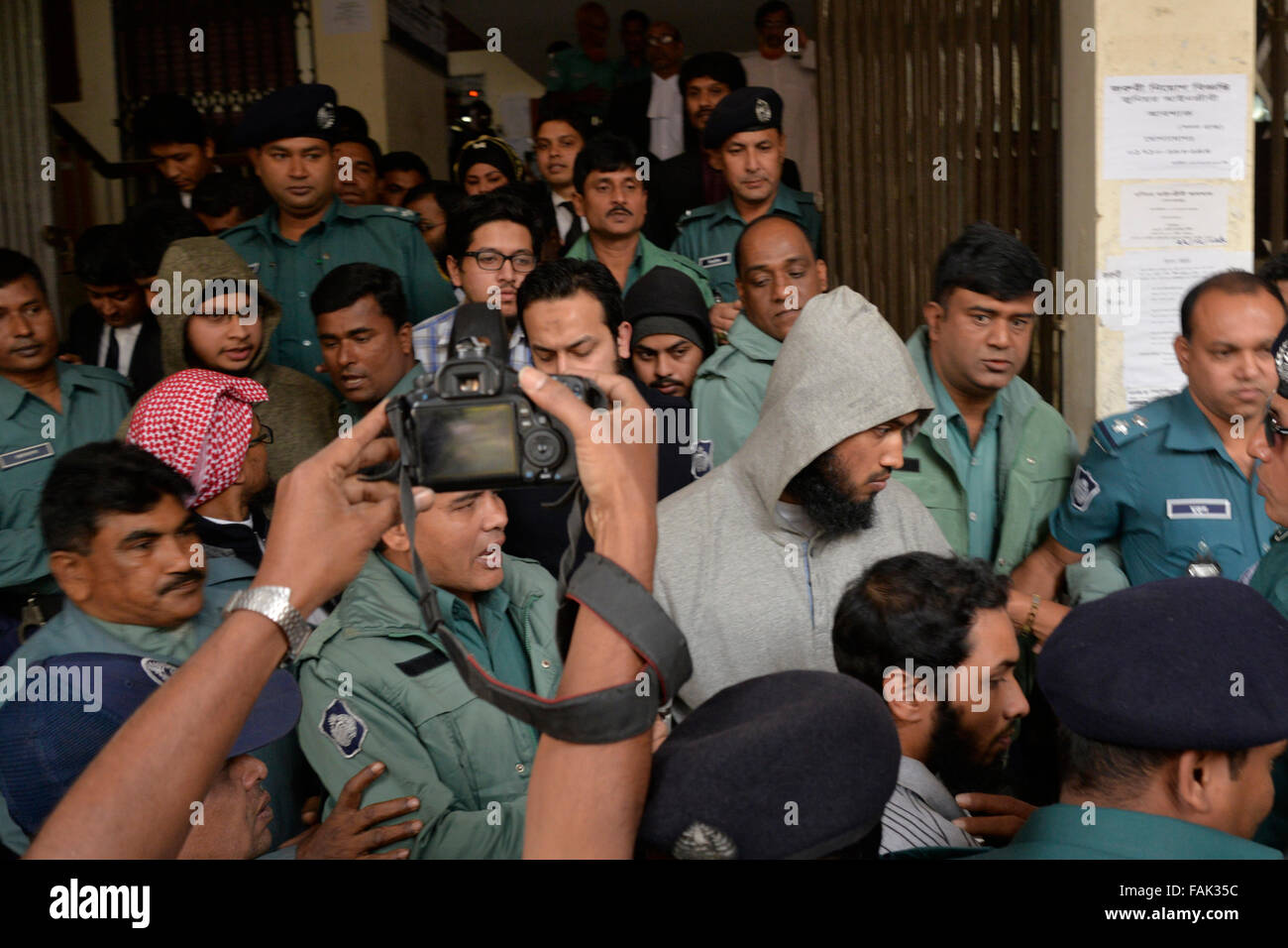 Dhaka, Bangladesh. 31st Dec, 2015. Bangladesh police officials escort ...
