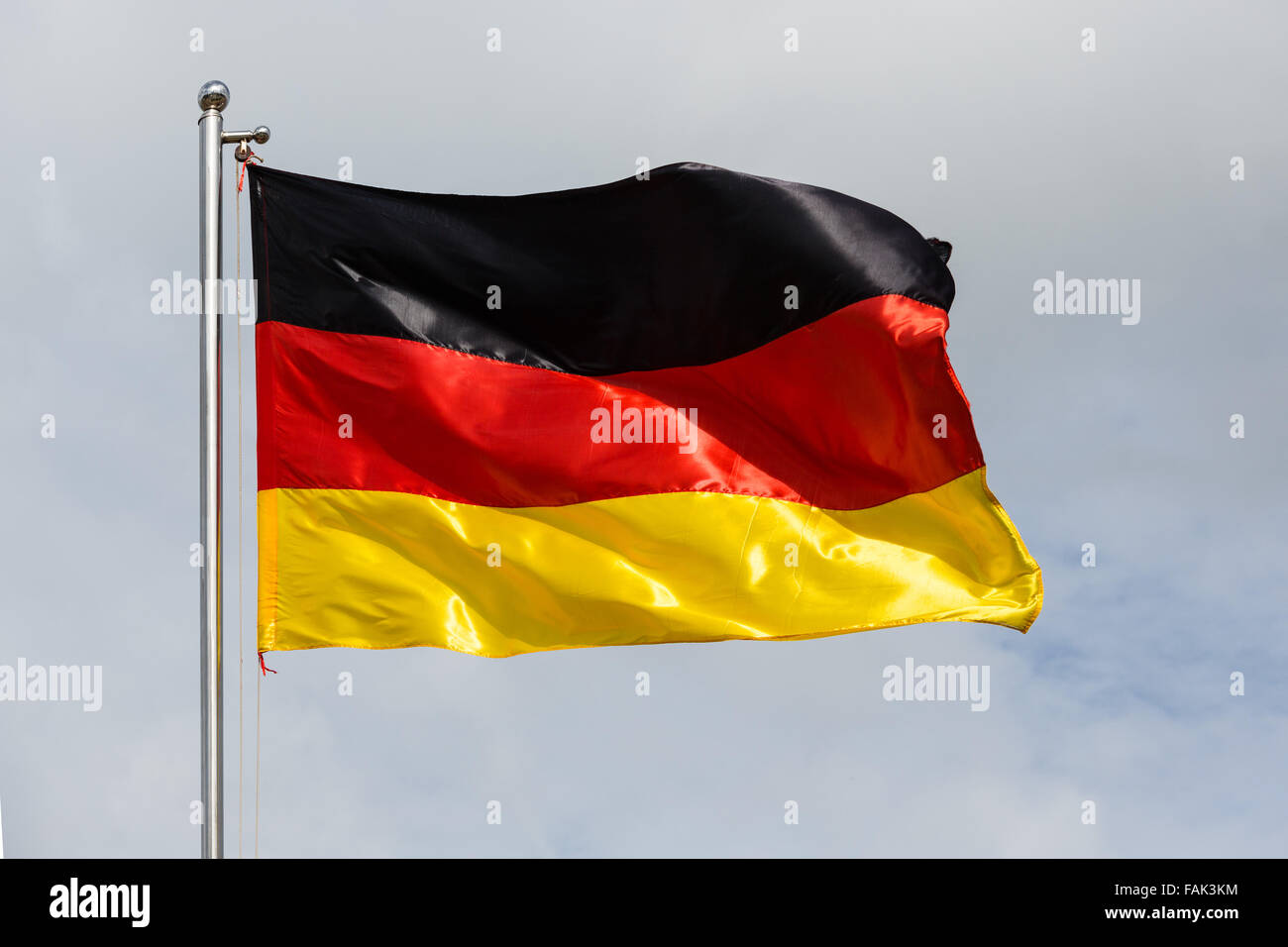 German Flag waving in the wind Stock Photo - Alamy