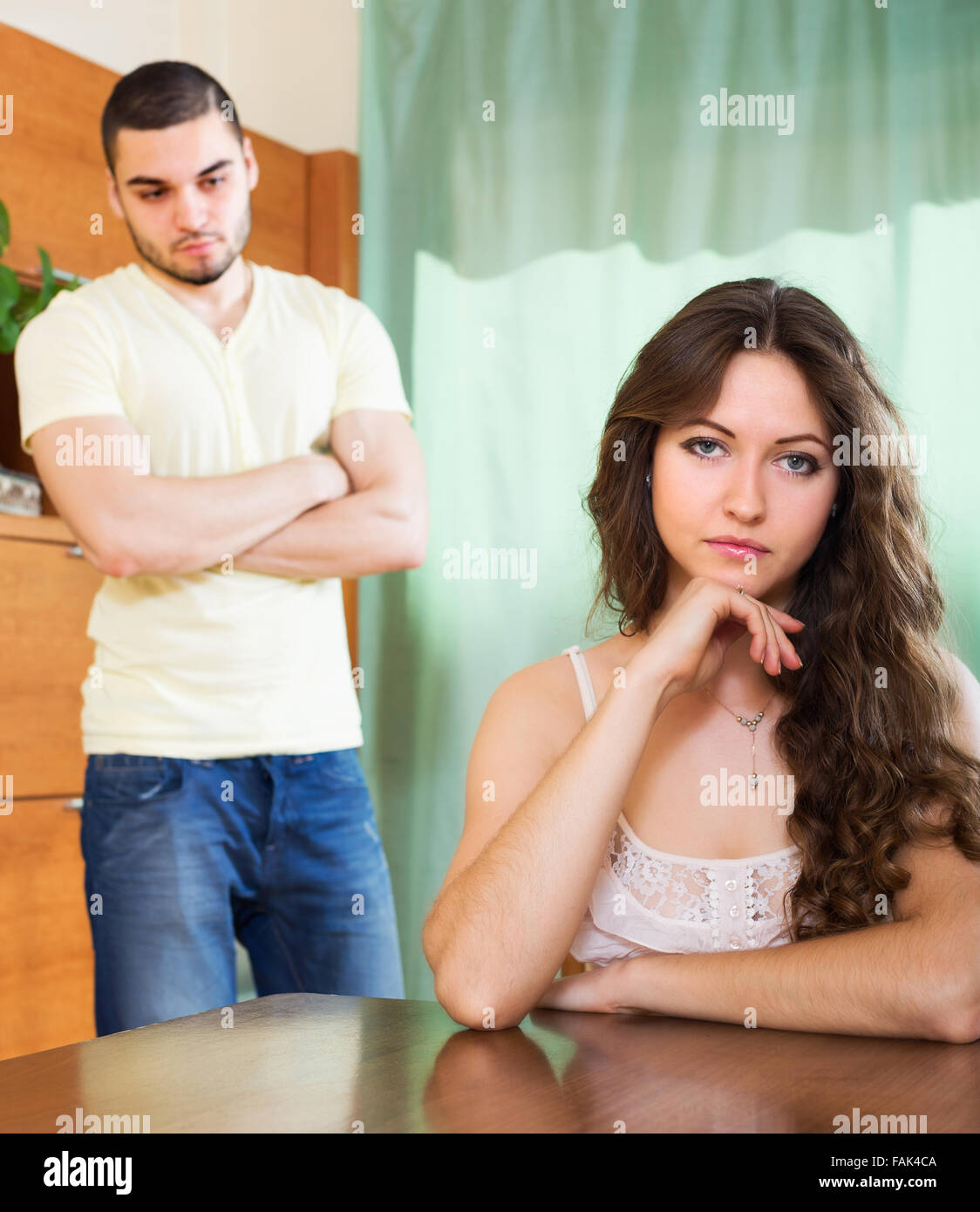 Unhappy female and sad man after quarrel in living room at home Stock ...