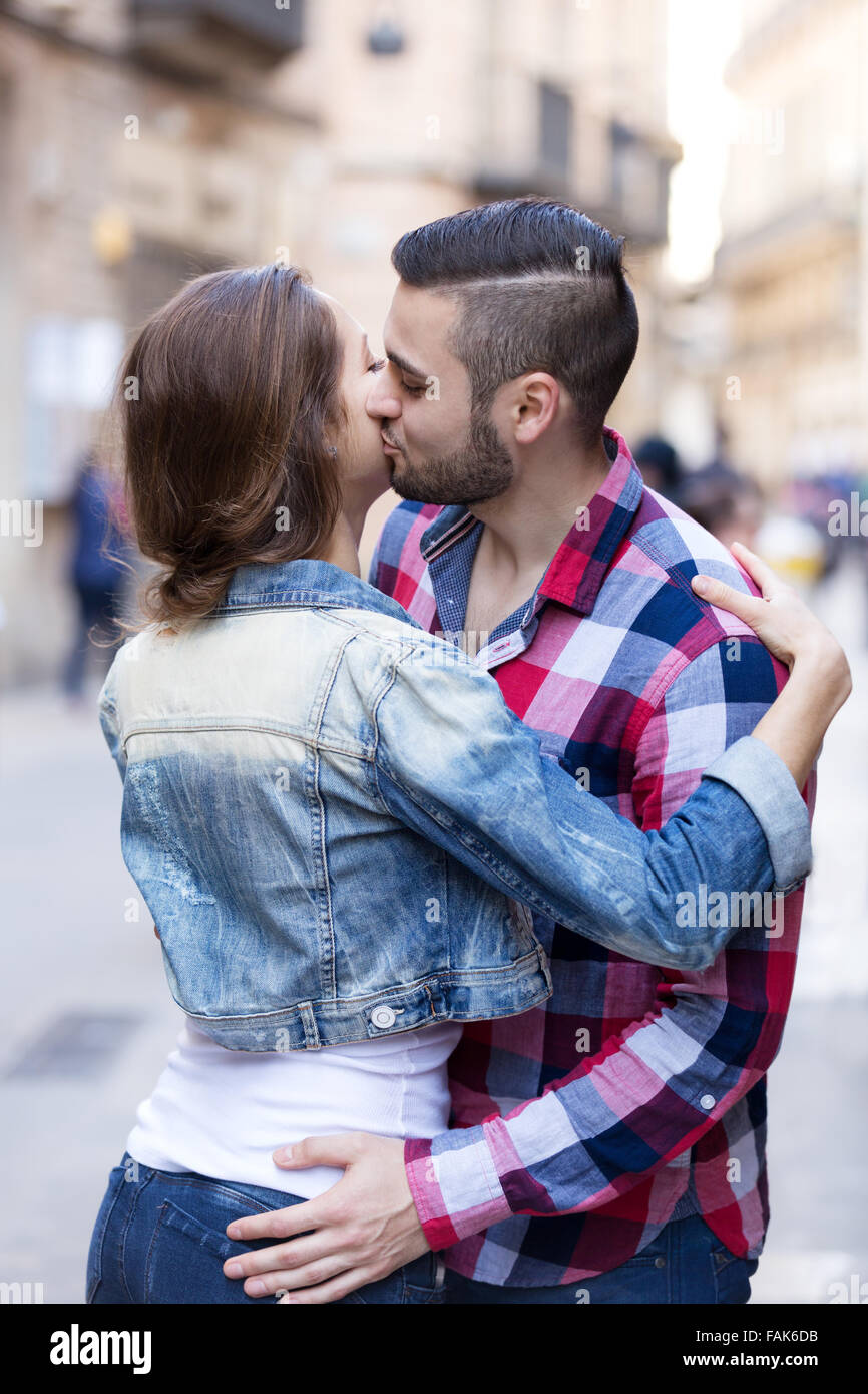 Smiling man meeting his girlfriend at city street Stock Photo - Alamy