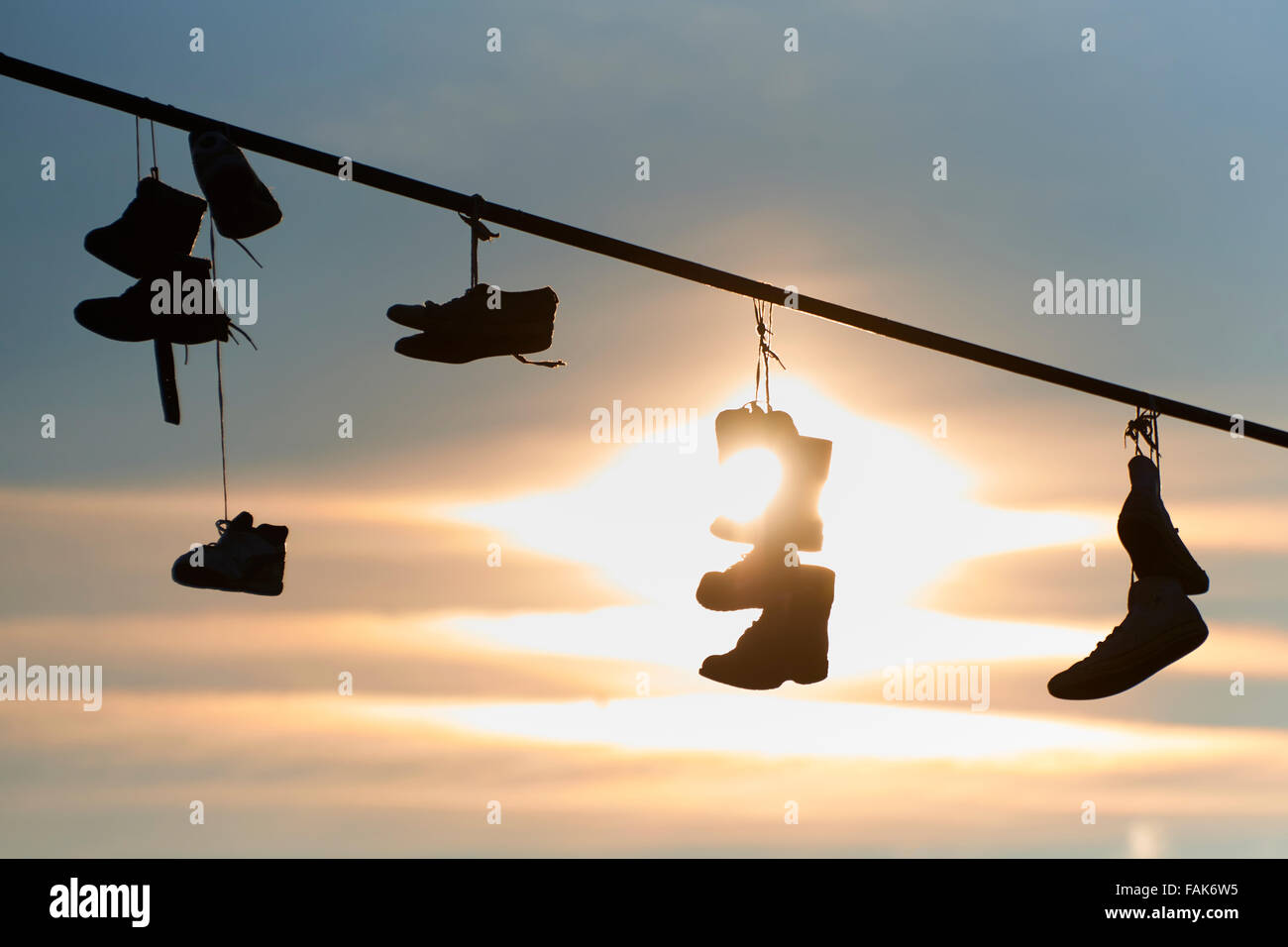 Shoes Hanging from Wire Stock Photo - Alamy