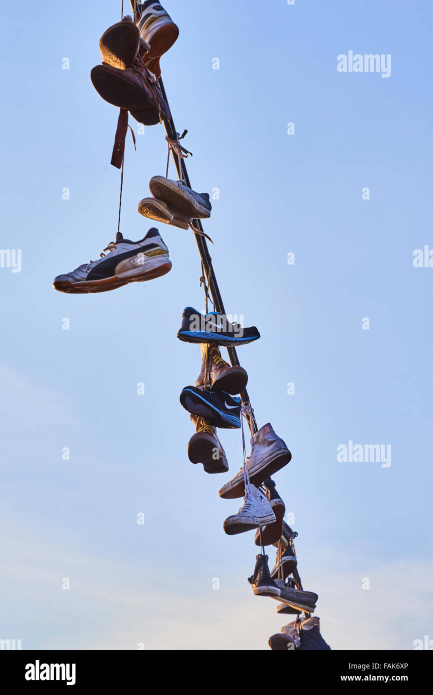 Shoes Hanging from Wire Stock Photo - Alamy