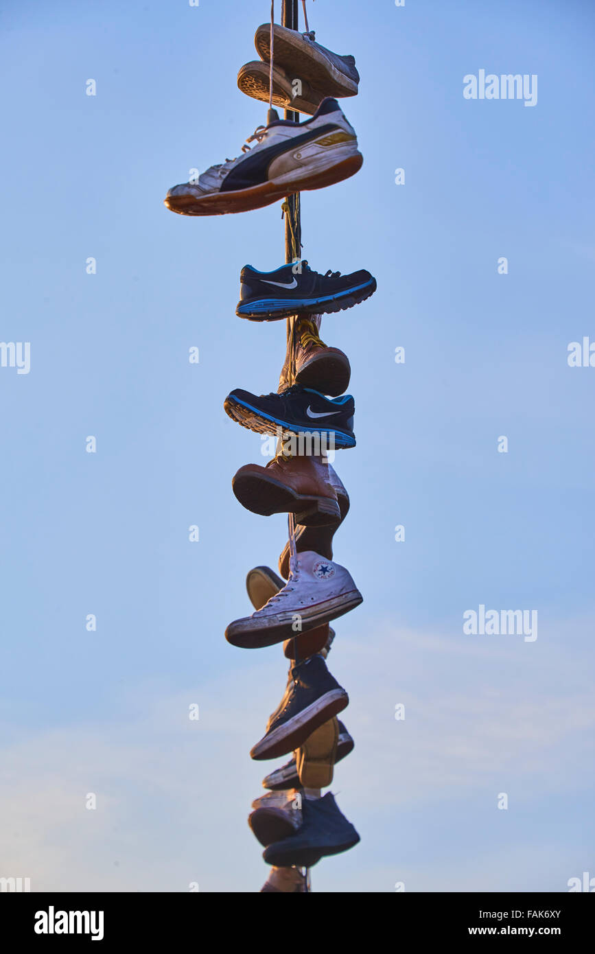 Shoes hanging from wire hi-res stock photography and images - Alamy