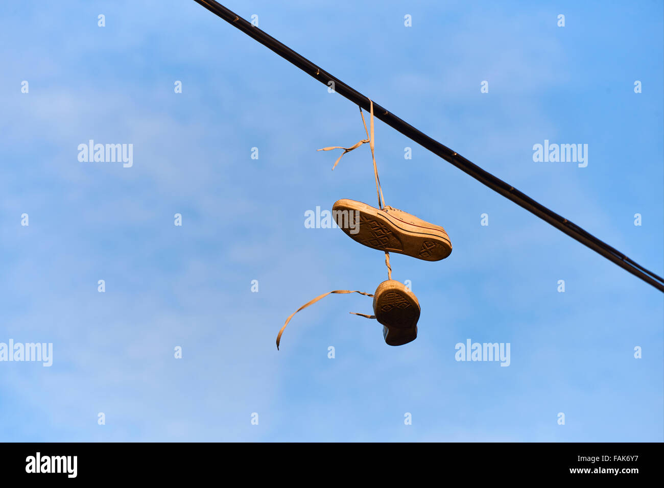 Shoes Hanging from Wire Stock Photo - Alamy