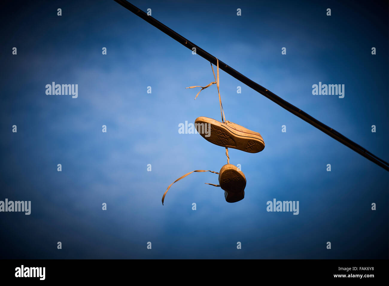 Shoes Hanging from Wire Stock Photo - Alamy
