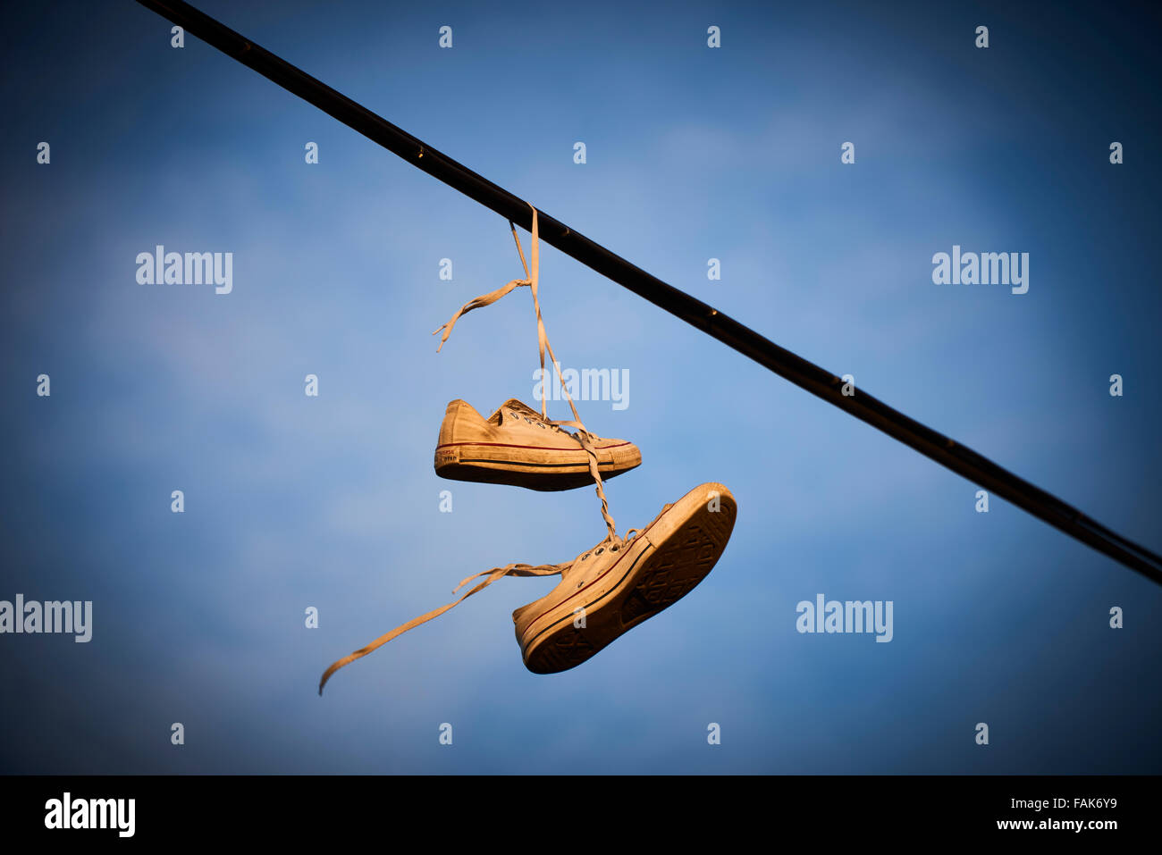 Shoes Hanging from Wire Stock Photo - Alamy