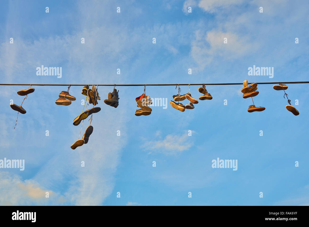 Shoes Hanging from Wire Stock Photo - Alamy