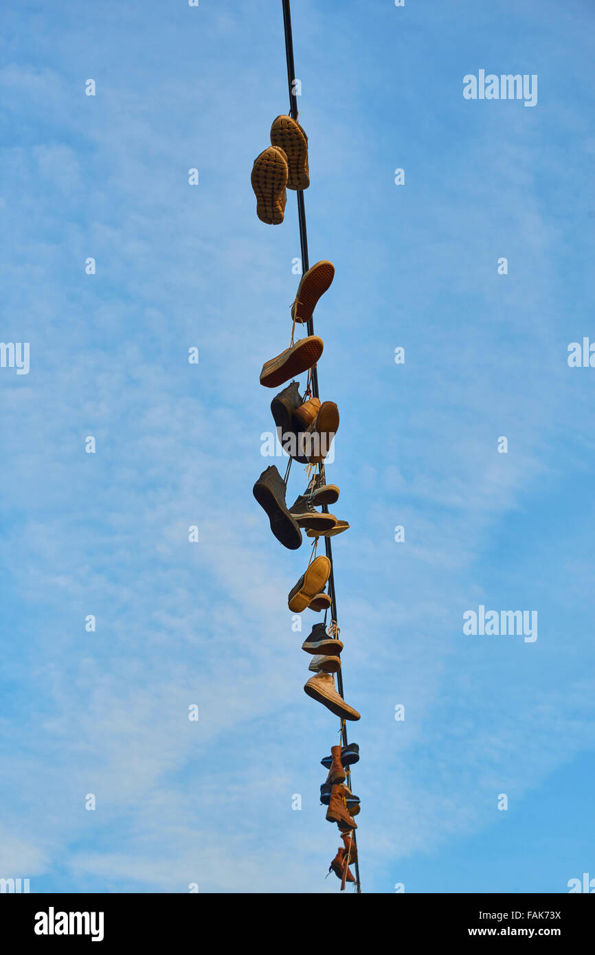 Shoes Hanging from Wire Stock Photo - Alamy