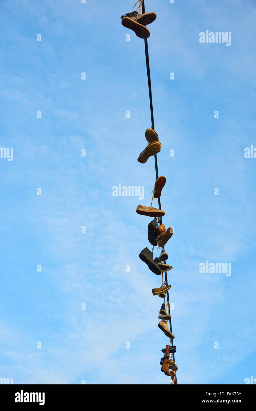 Shoes Hanging from Wire Stock Photo - Alamy
