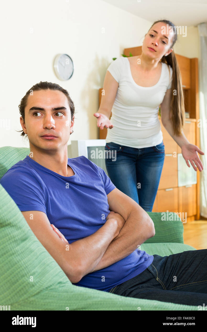 Sad young married couple having problems at home Stock Photo - Alamy