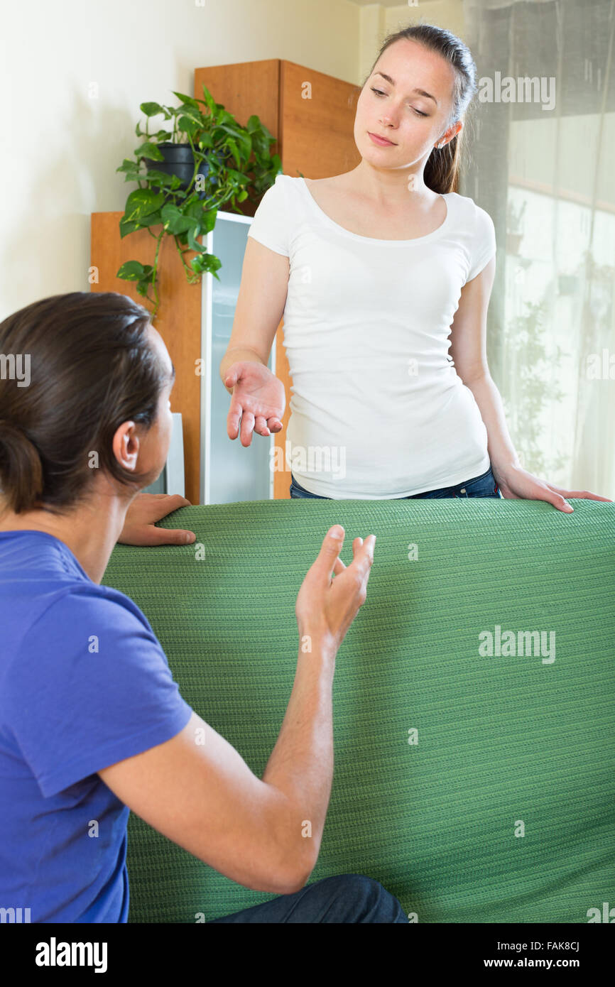 Family having serious discussion in home interior. Focus on woman Stock ...