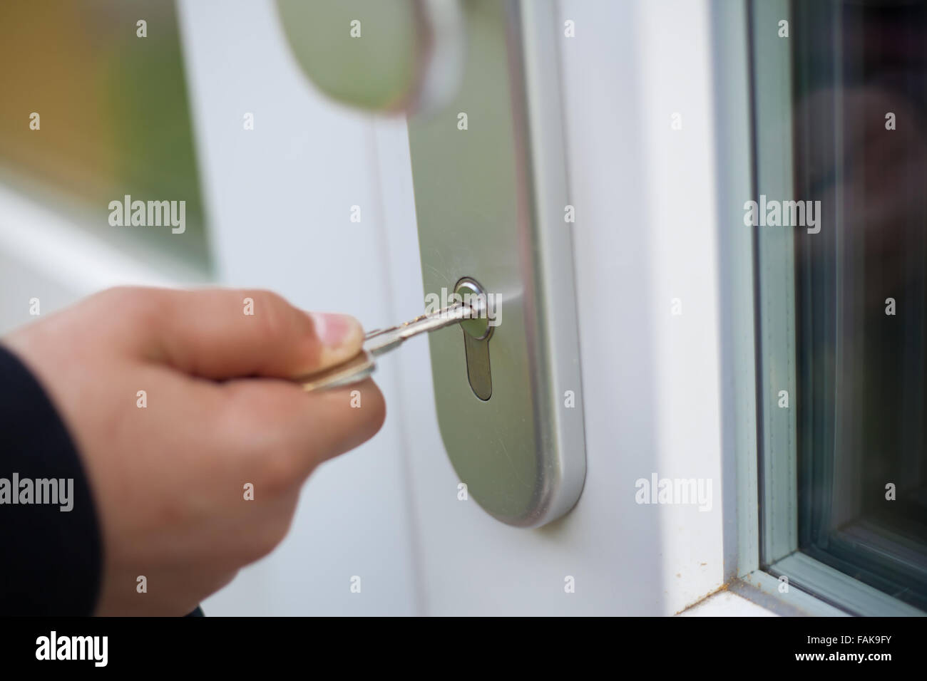 Closeup unlocking outdoor security doors (shallow DOF Stock Photo - Alamy