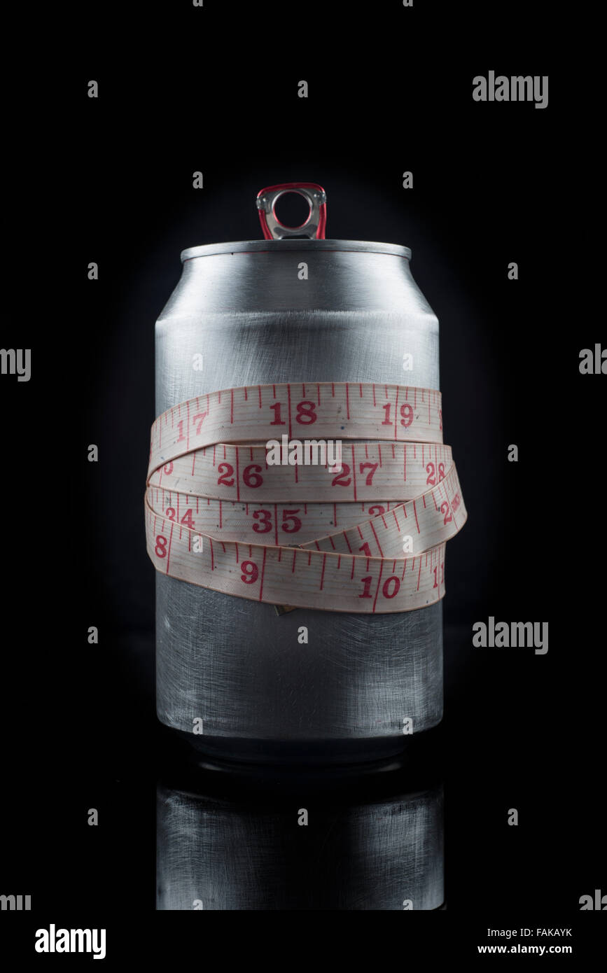 can of cola drink with tape measure, concept Stock Photo - Alamy