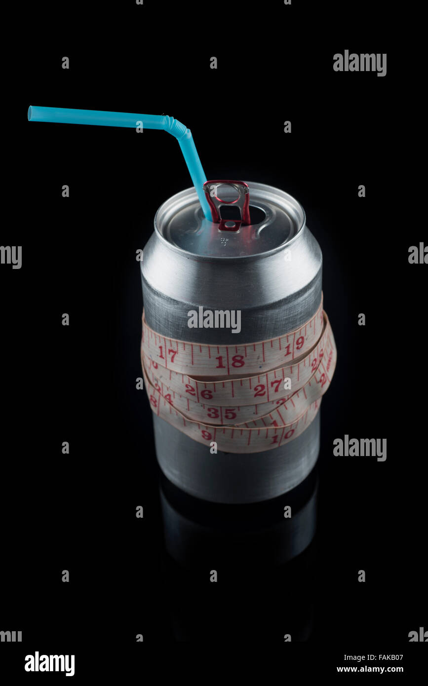 can of cola drink with tape measure, concept Stock Photo - Alamy