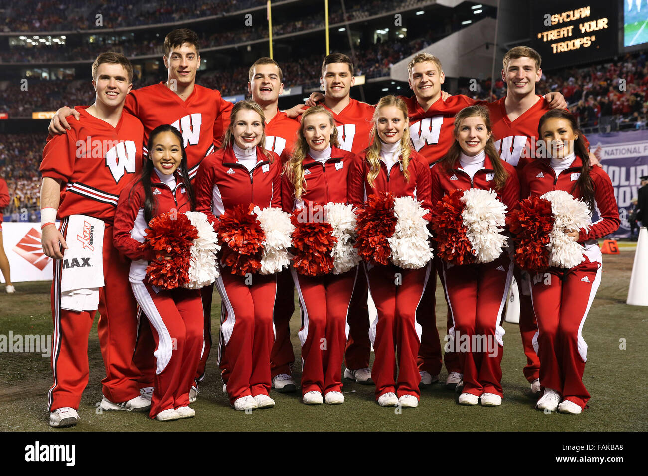San Diego, CA. 30th Dec, 2015. The Wisconsin cheer squad take a team ...
