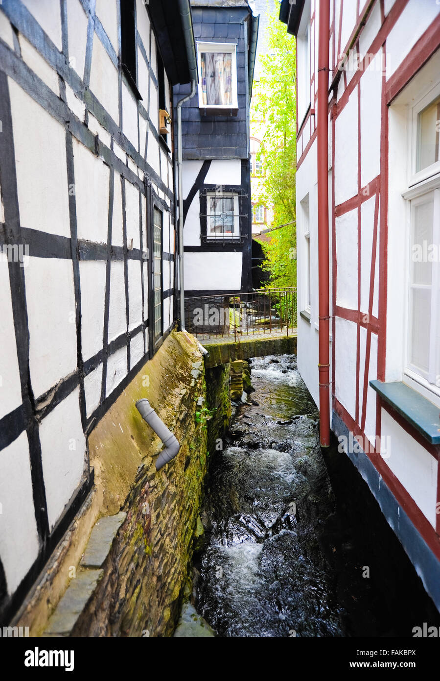 Stream between buildings in Monschau Germany Stock Photo - Alamy