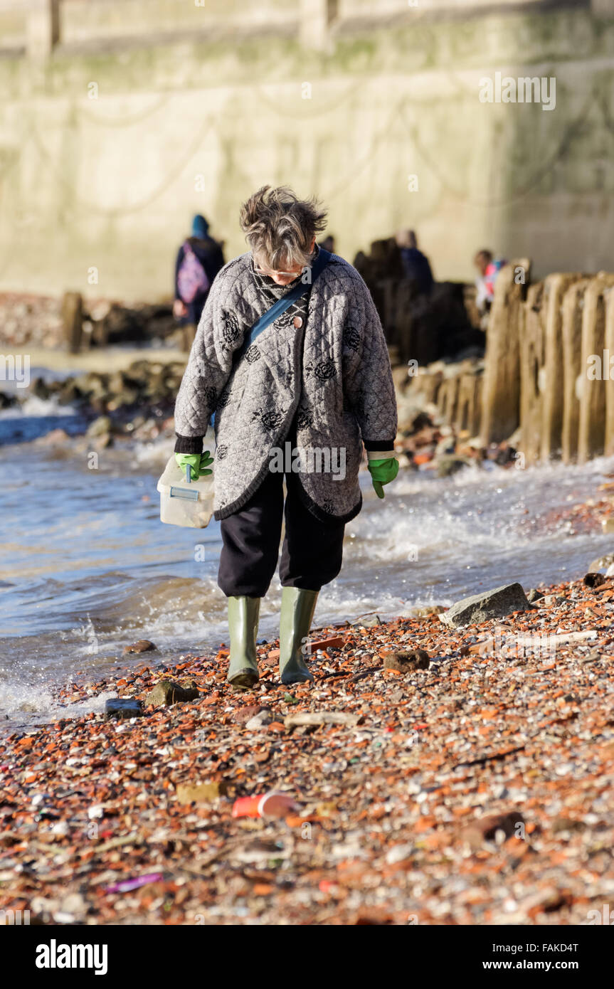 People mudlarking on the River Thames, London England United Kingdom UK ...