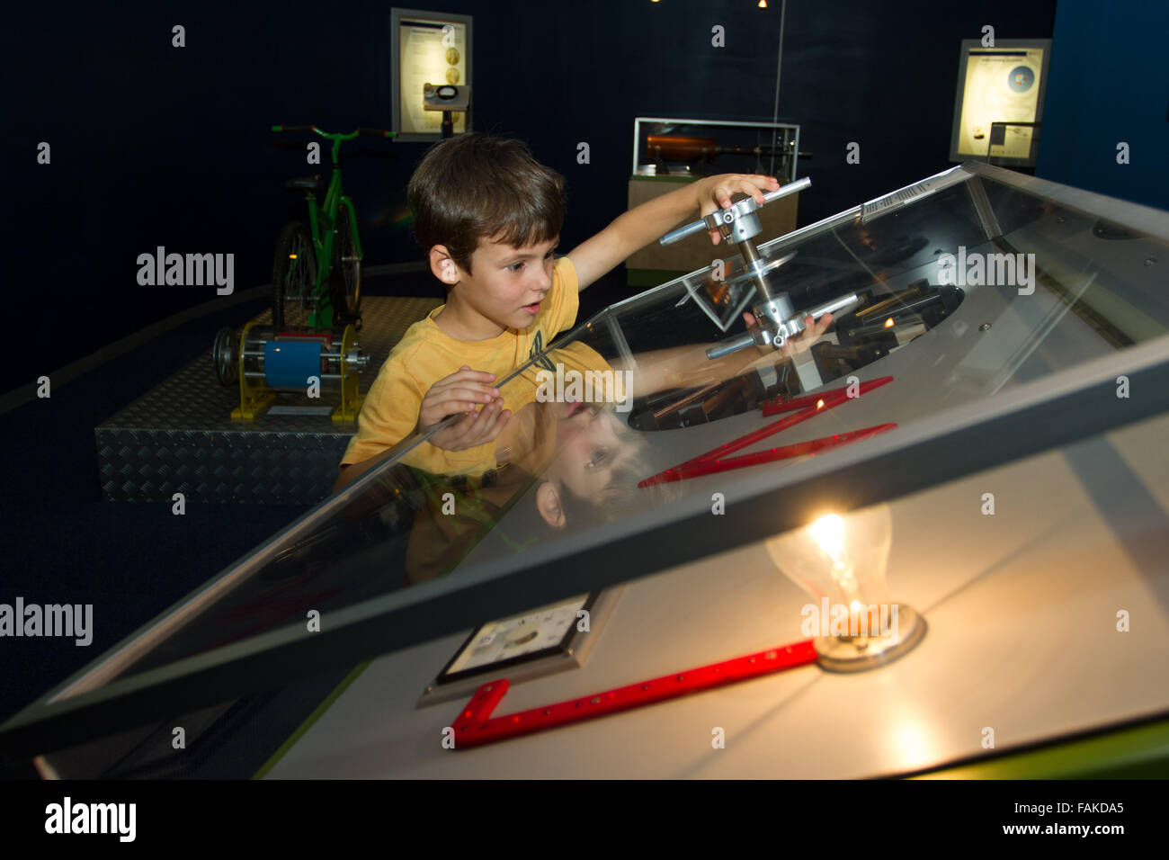 Young boy plays with an exhibit at the Koeberg nuclear power station ...