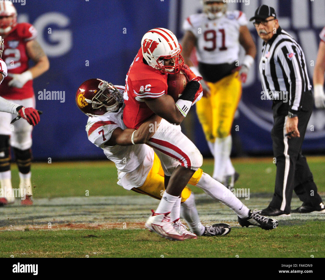 December 19, 2015. Marvell Tell III #7 of USC tackles Austin Traylor ...