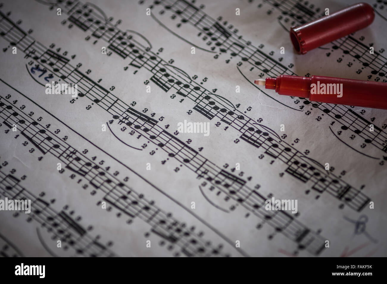 Close up of piano classic music score and notes and old paper with red ...