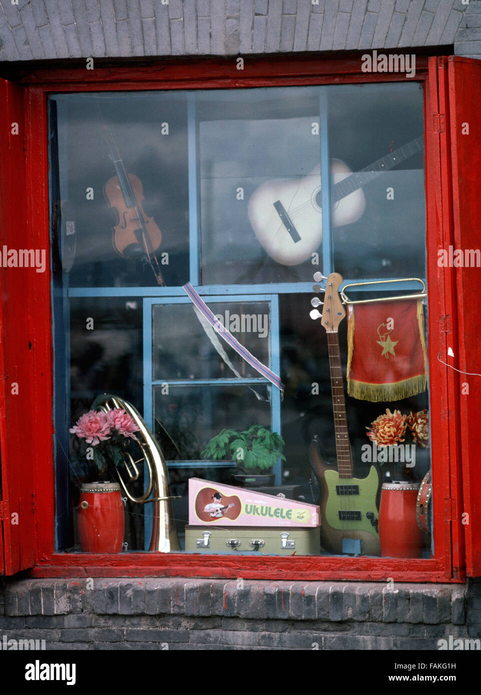 Musical instruments in shop window, Hohhot, capital of Inner Mongolia ...