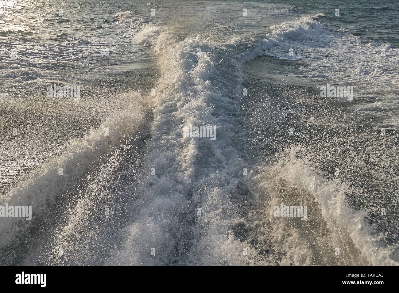 Boat wake, trail in sea after fast moving Stock Photo - Alamy
