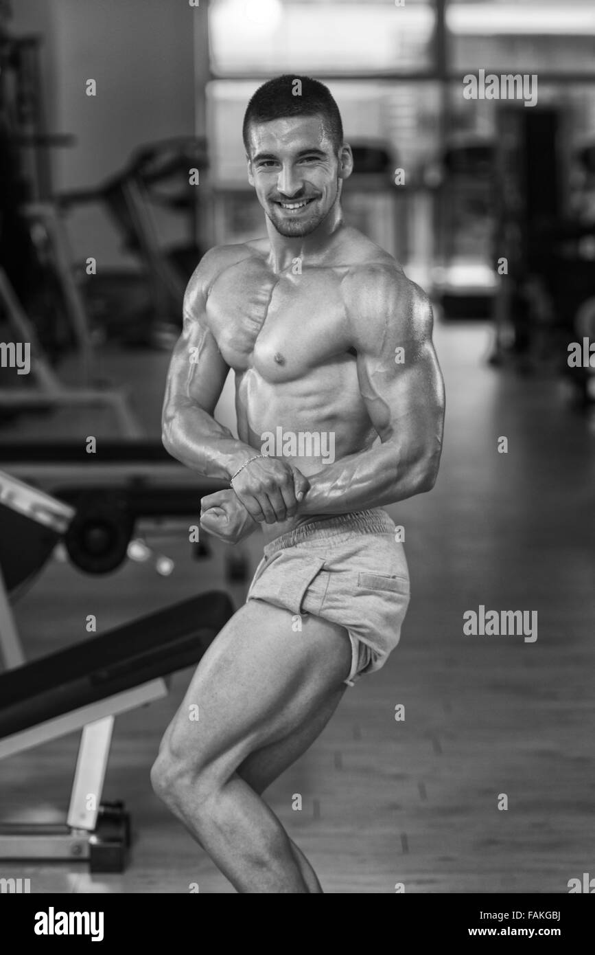 Young bodybuilder showing muscles Black and White Stock Photos & Images ...